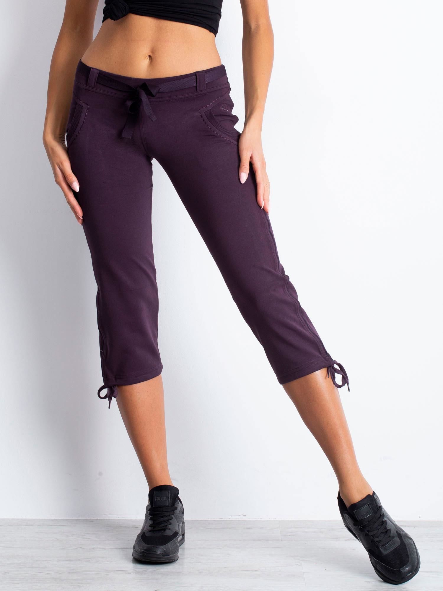 Dark purple sweatpants below the knee